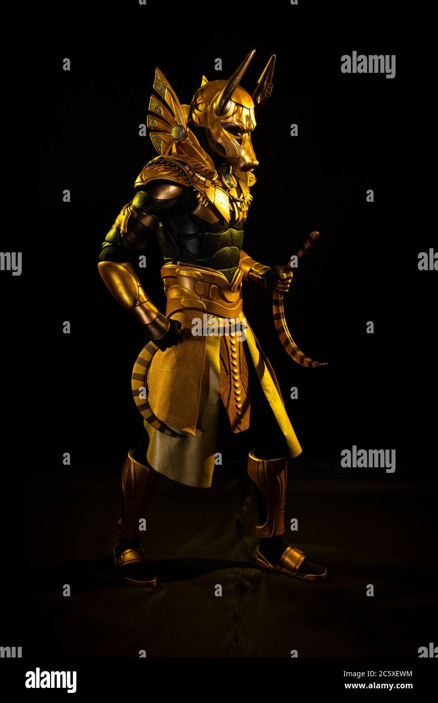 a male actor in a suit of an Egyptian mythology character, the golden ...