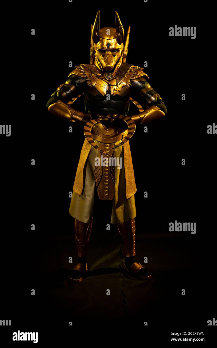 a male actor in a suit of an Egyptian mythology character, the golden ...