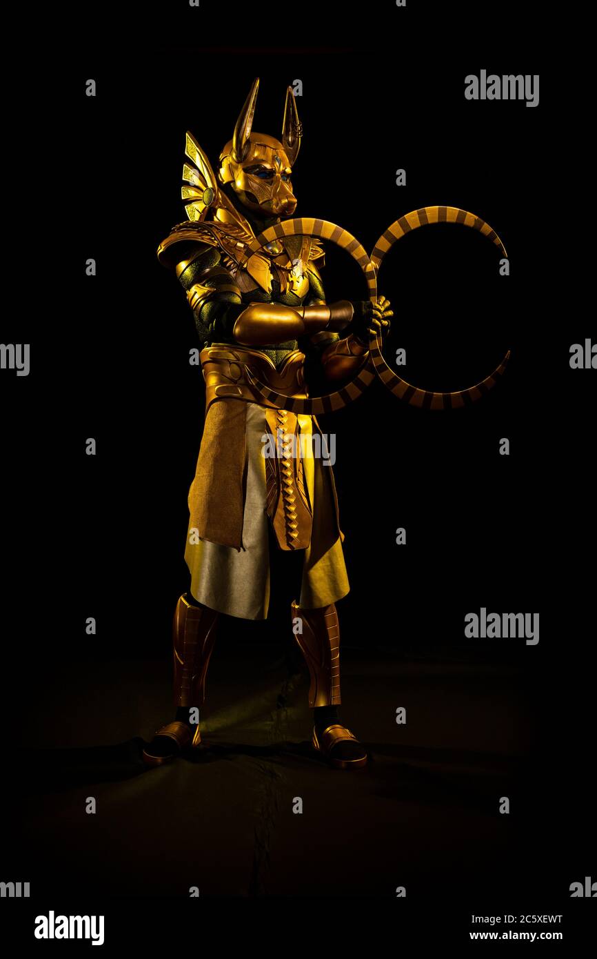 a male actor in a suit of an Egyptian mythology character, the golden ...