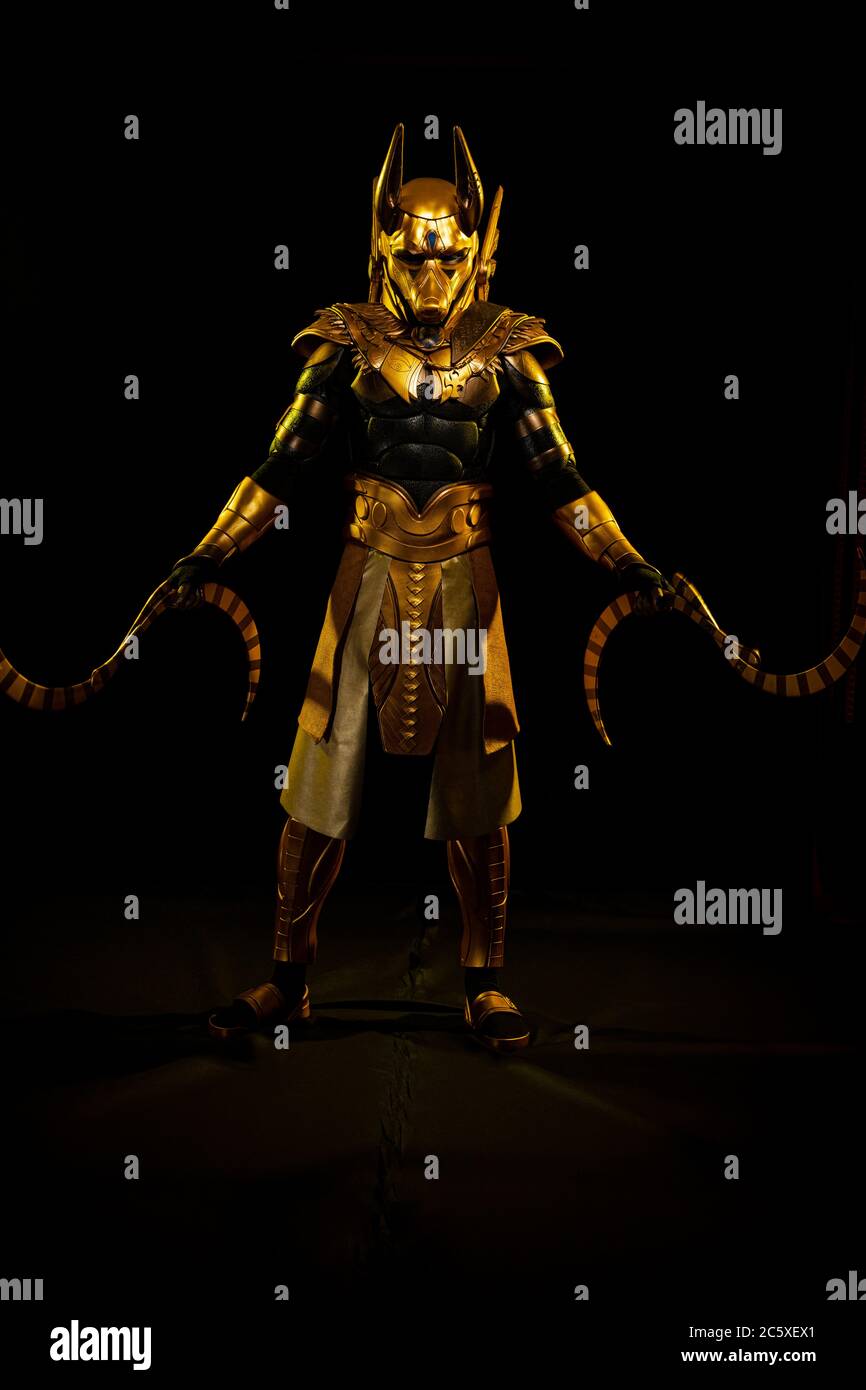 a male actor in a suit of an Egyptian mythology character, the golden ...