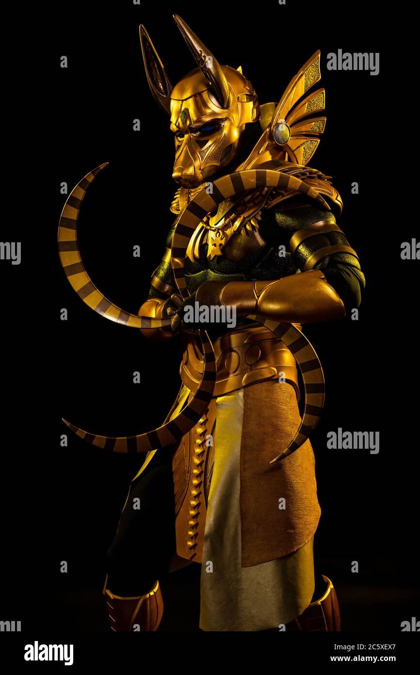 a male actor in a suit of an Egyptian mythology character, the golden ...