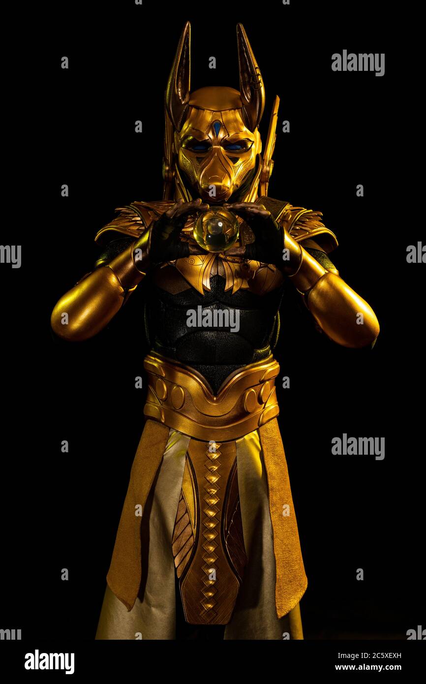 a male actor in a suit of an Egyptian mythology character, the golden ...