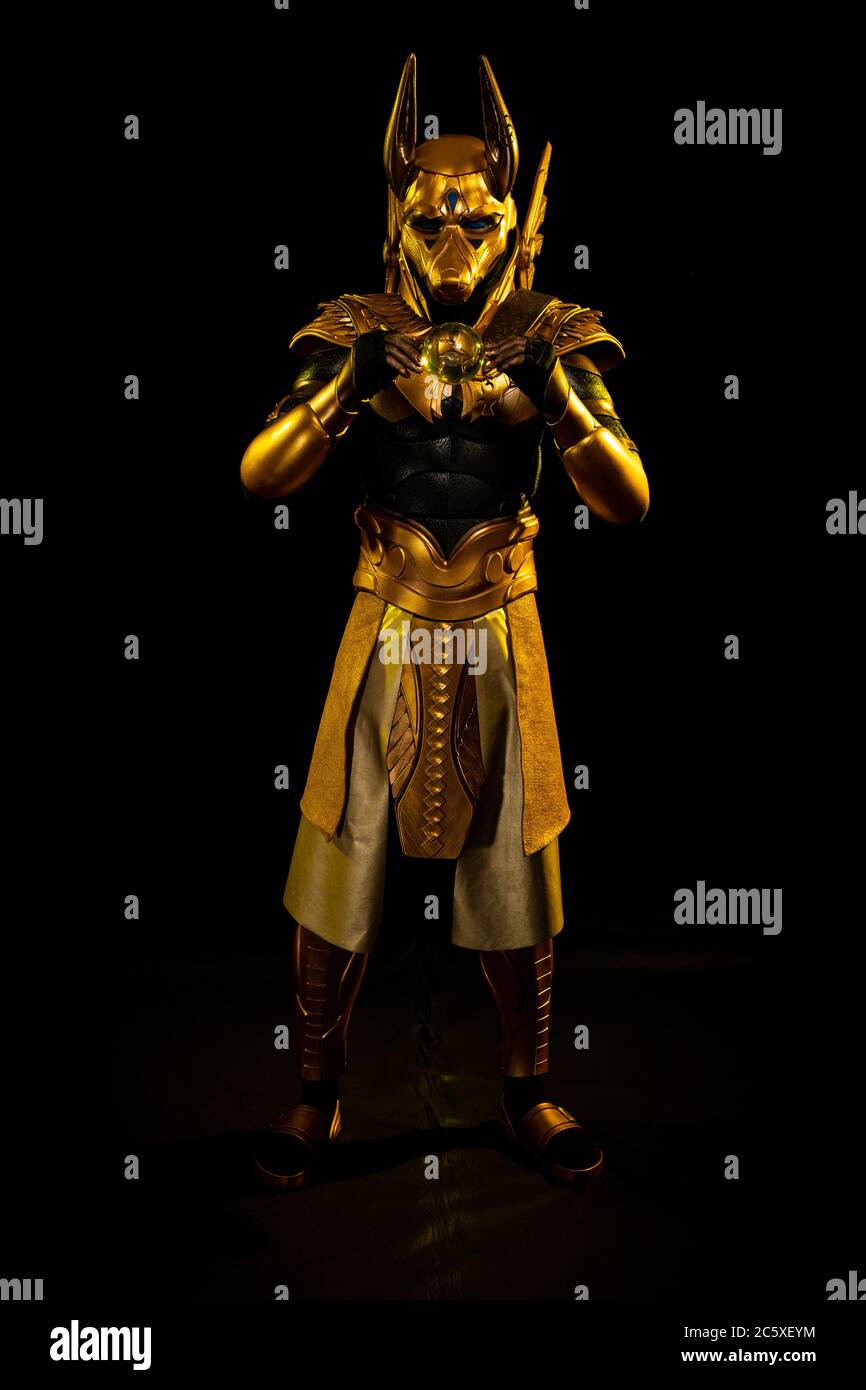 a male actor in a suit of an Egyptian mythology character, the golden ...