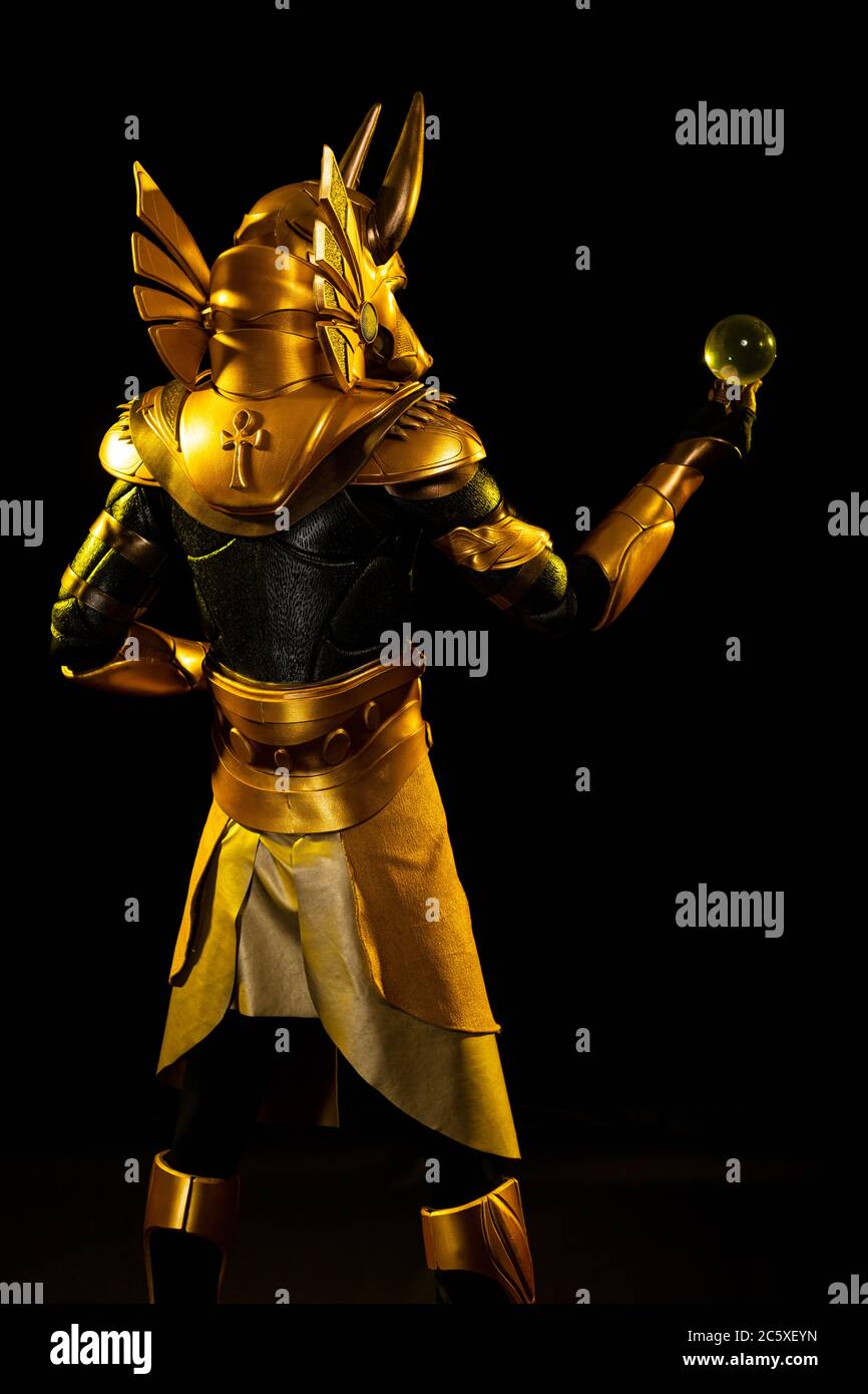 a male actor in a suit of an Egyptian mythology character, the golden ...