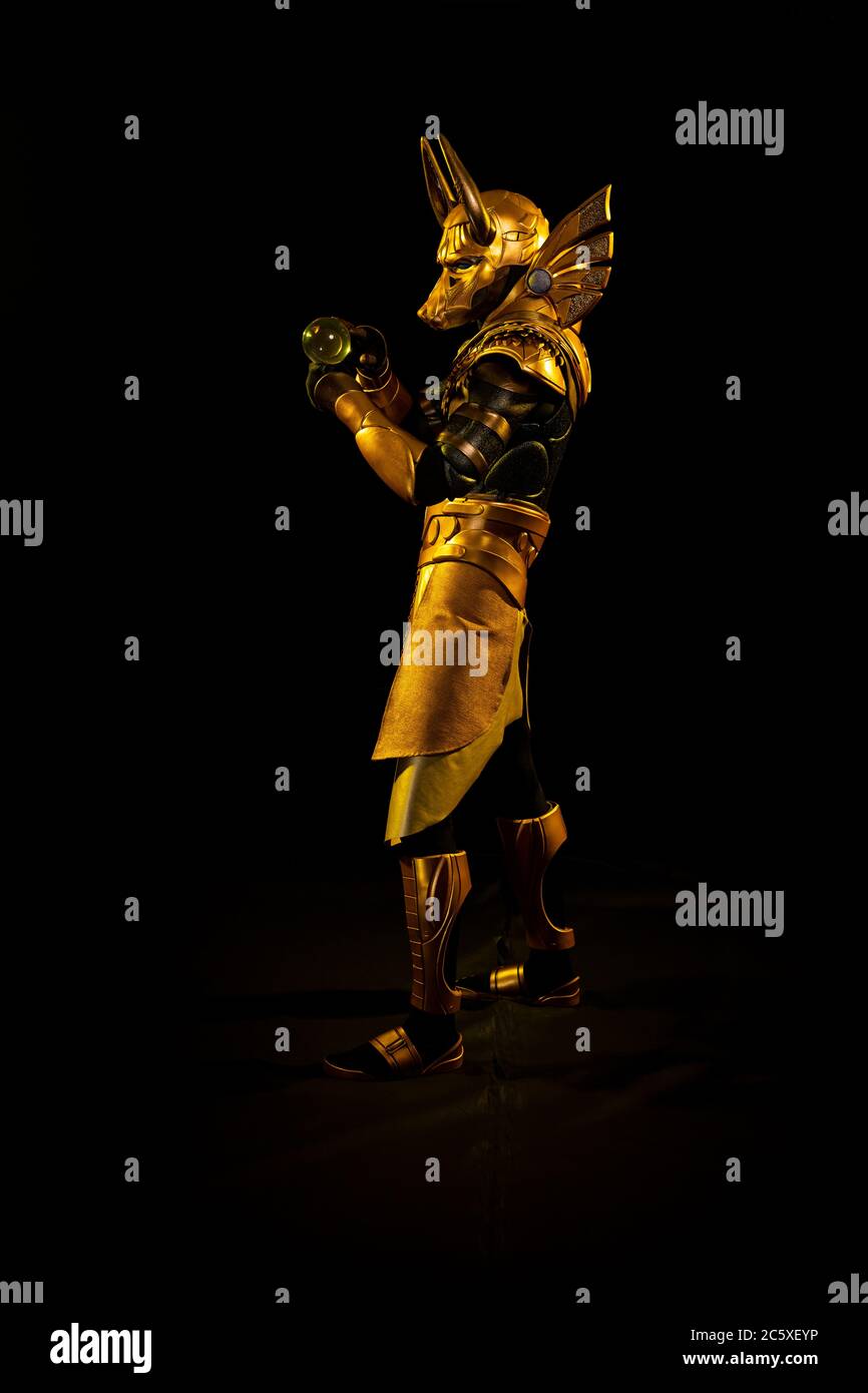a male actor in a suit of an Egyptian mythology character, the golden ...