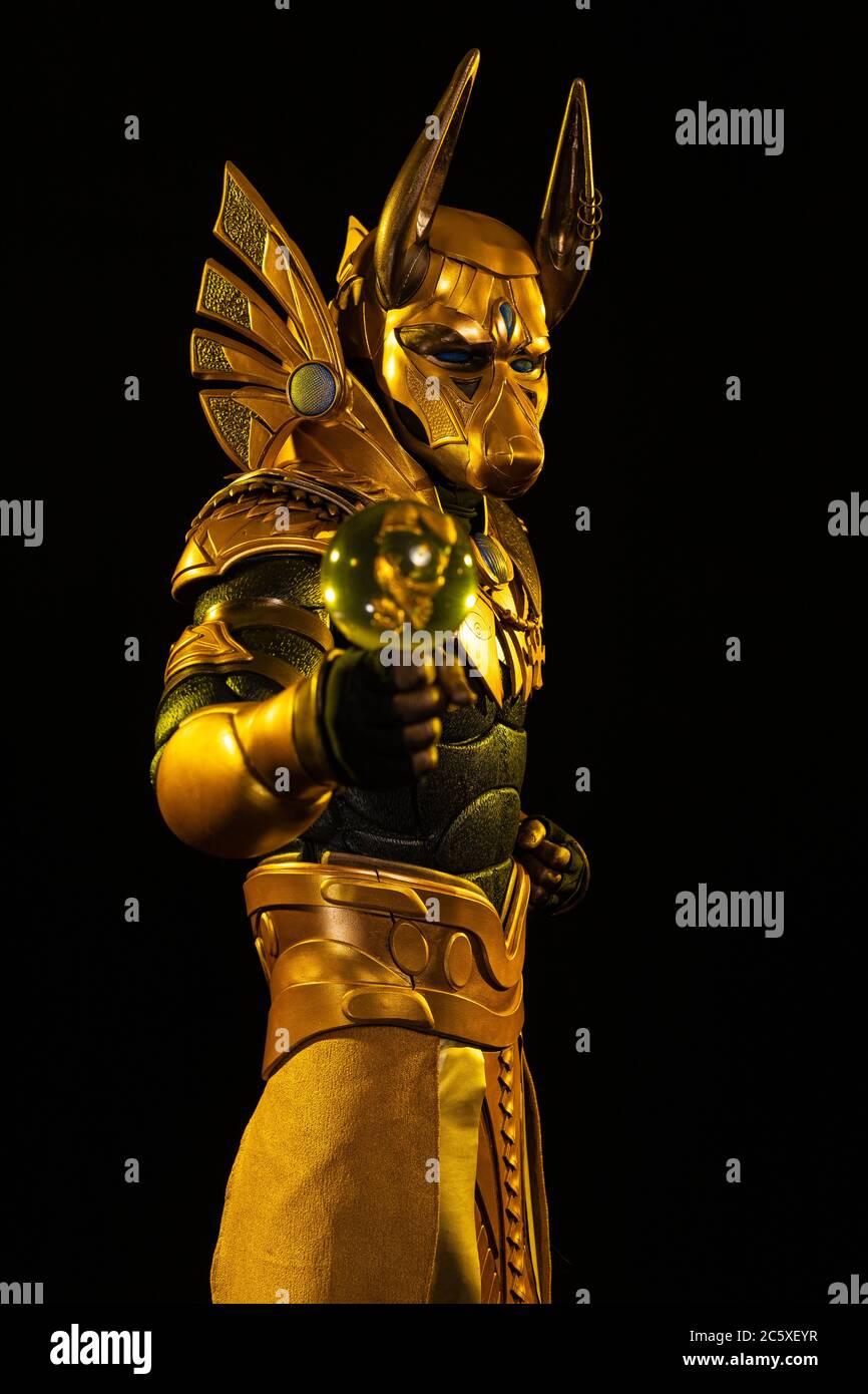 a male actor in a suit of an Egyptian mythology character, the golden ...