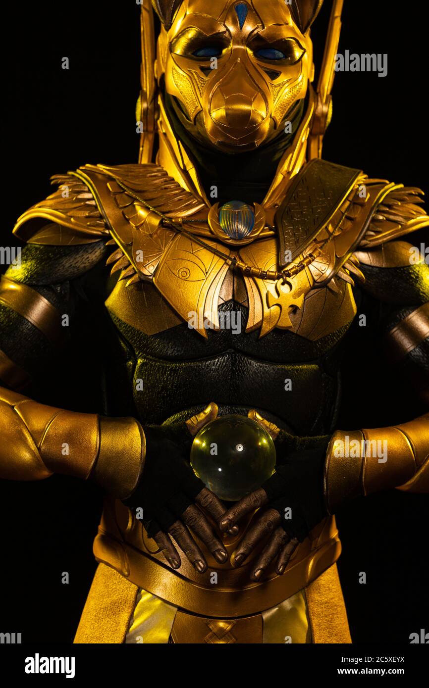a male actor in a suit of an Egyptian mythology character, the golden ...