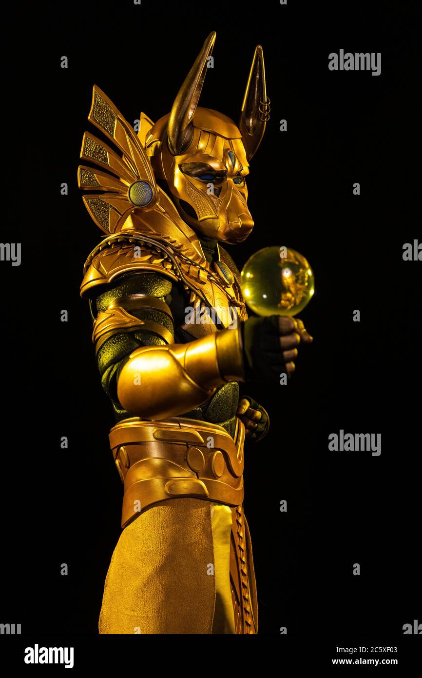 a male actor in a suit of an Egyptian mythology character, the golden ...