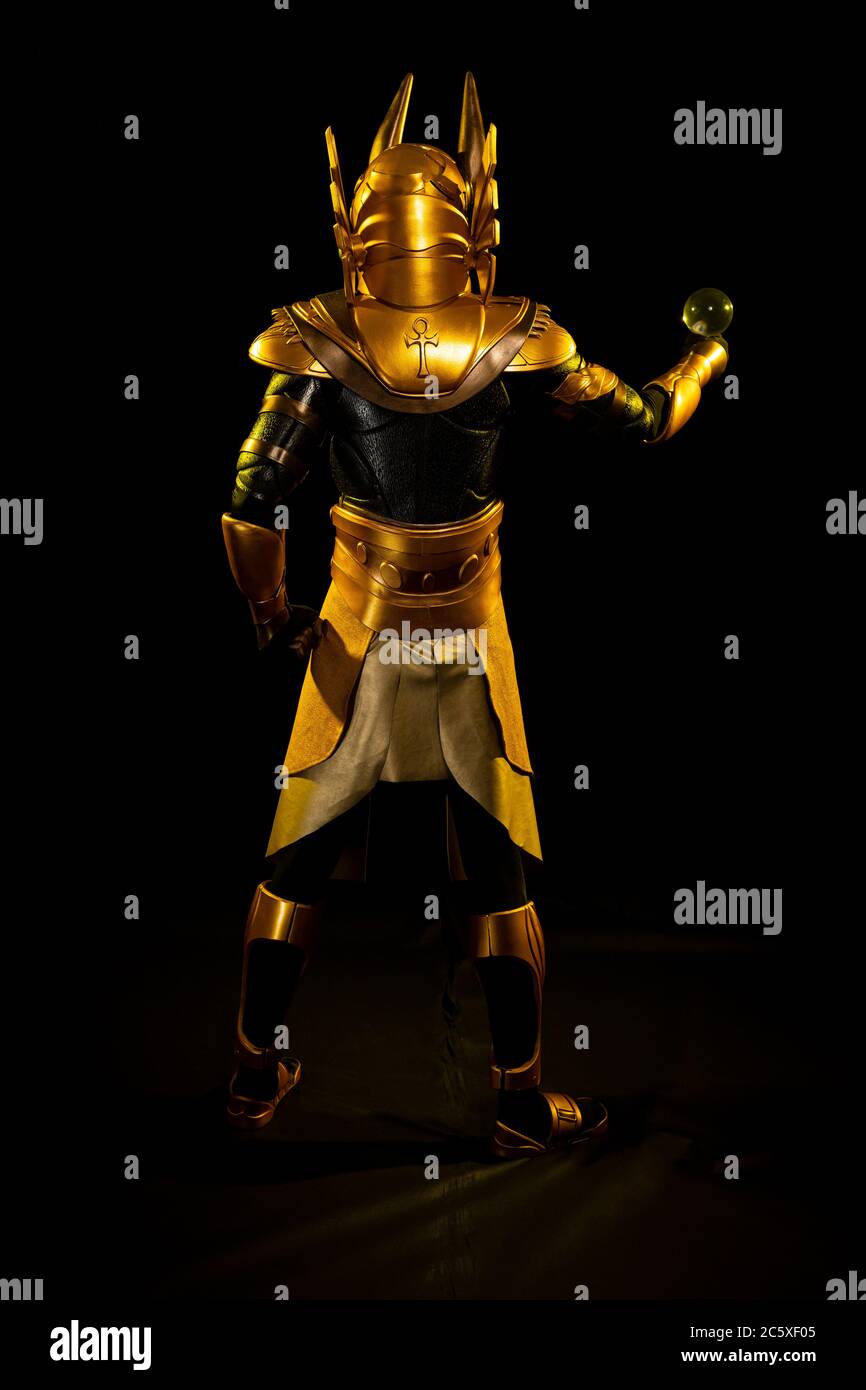a male actor in a suit of an Egyptian mythology character, the golden ...