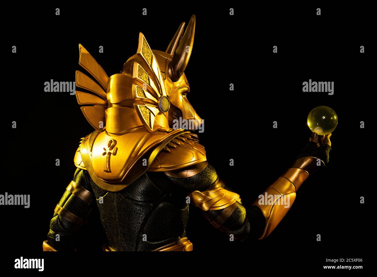 a male actor in a suit of an Egyptian mythology character, the golden ...