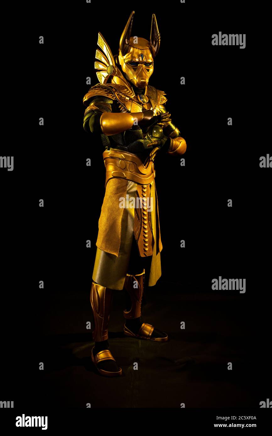 a male actor in a suit of an Egyptian mythology character, the golden ...