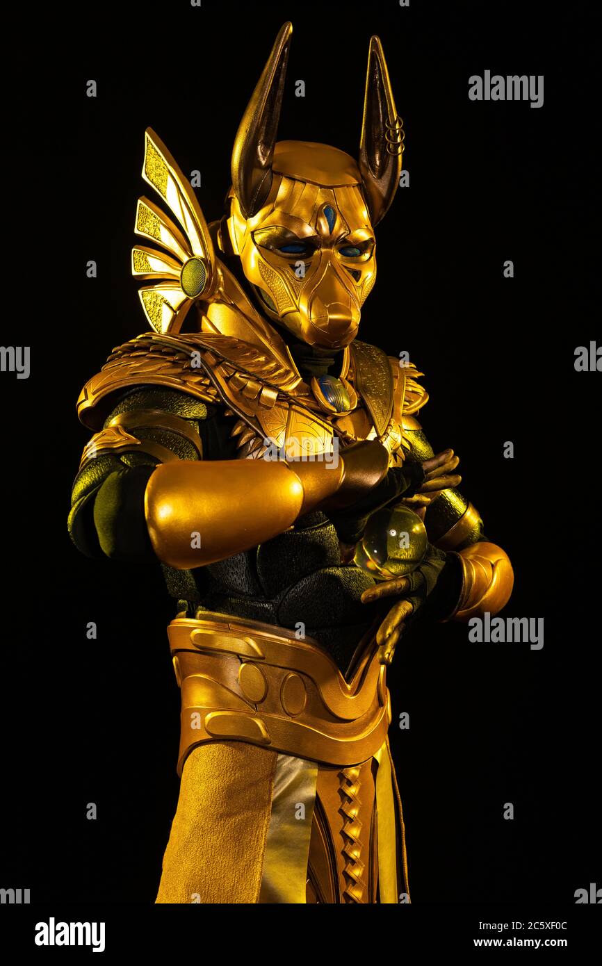 a male actor in a suit of an Egyptian mythology character, the golden ...