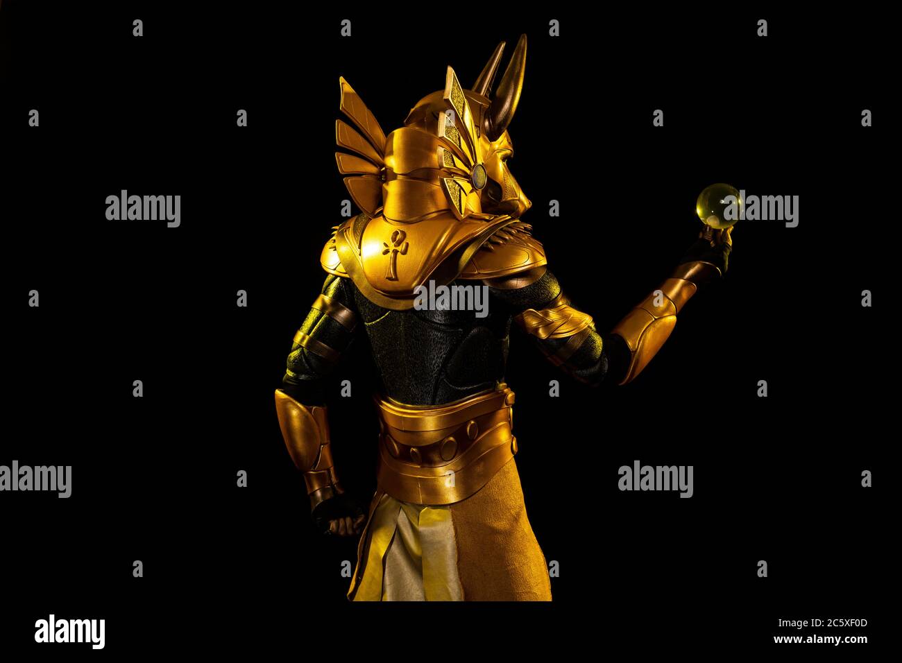 a male actor in a suit of an Egyptian mythology character, the golden ...