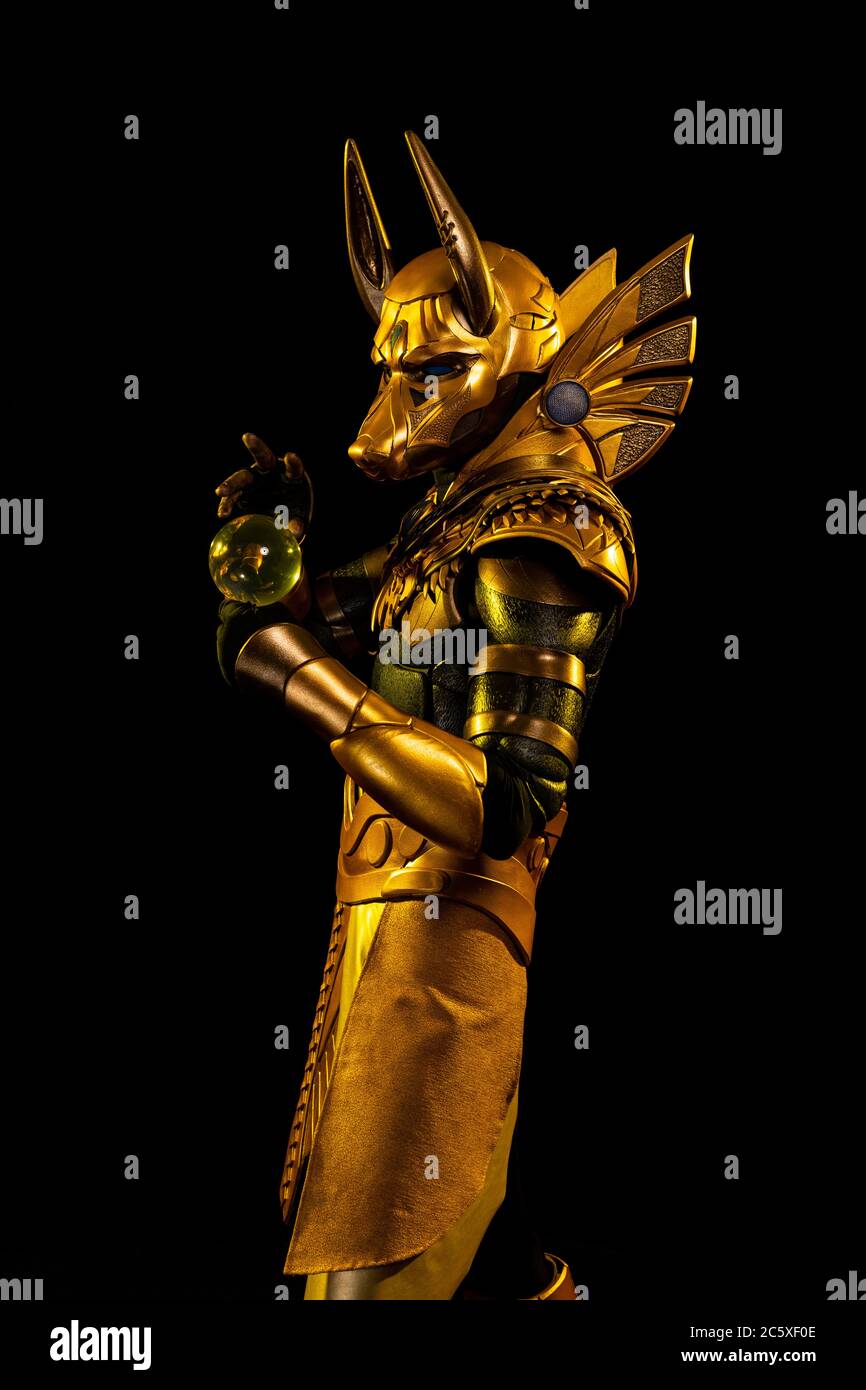 a male actor in a suit of an Egyptian mythology character, the golden ...