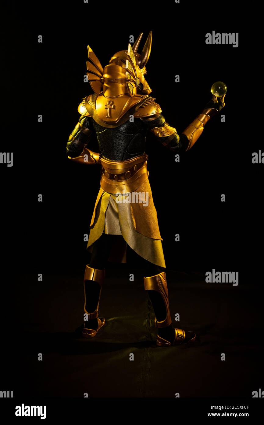 a male actor in a suit of an Egyptian mythology character, the golden ...