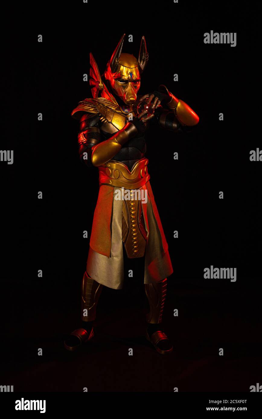 a male actor in a suit of an Egyptian mythology character, the golden ...