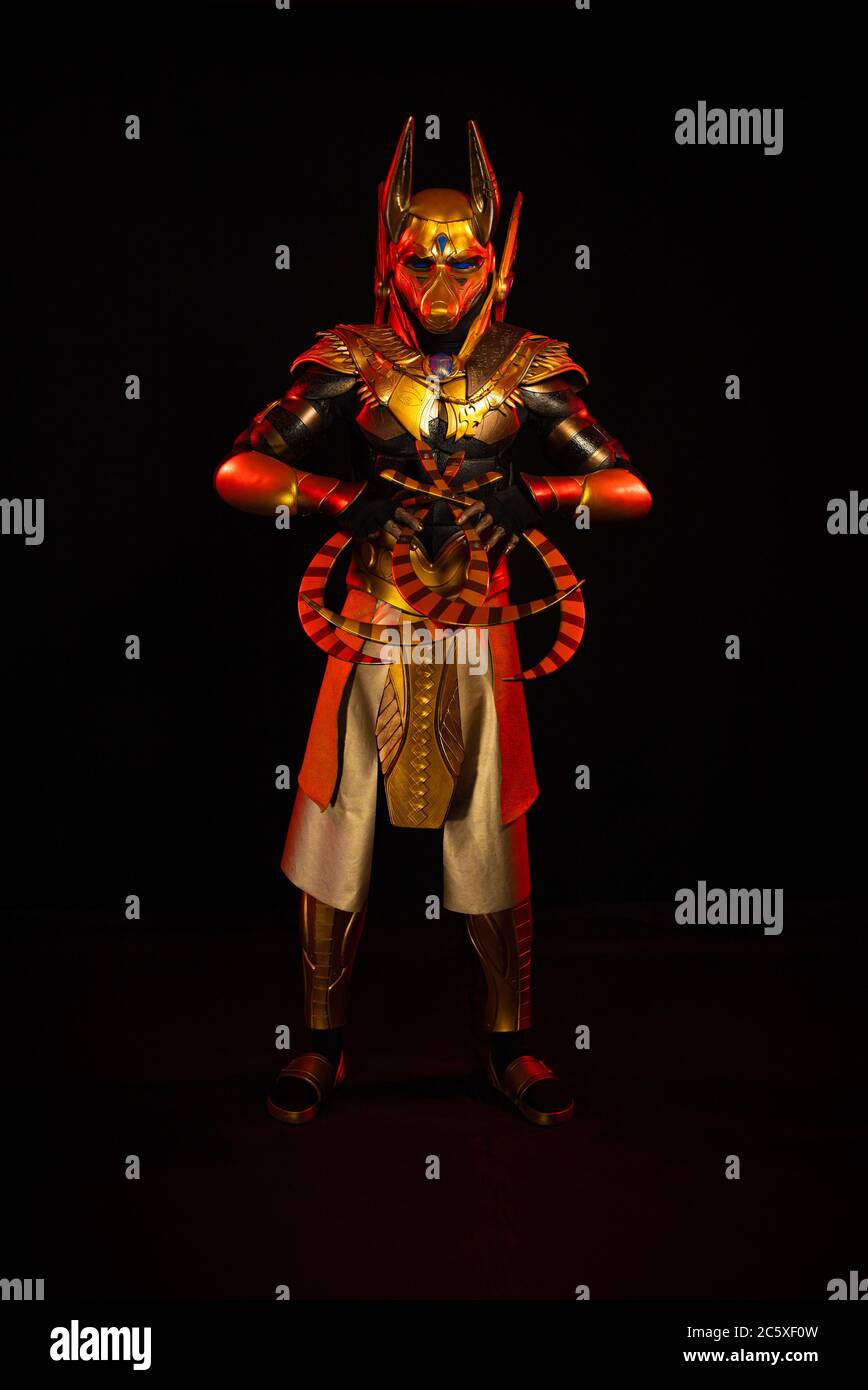 a male actor in a suit of an Egyptian mythology character, the golden ...