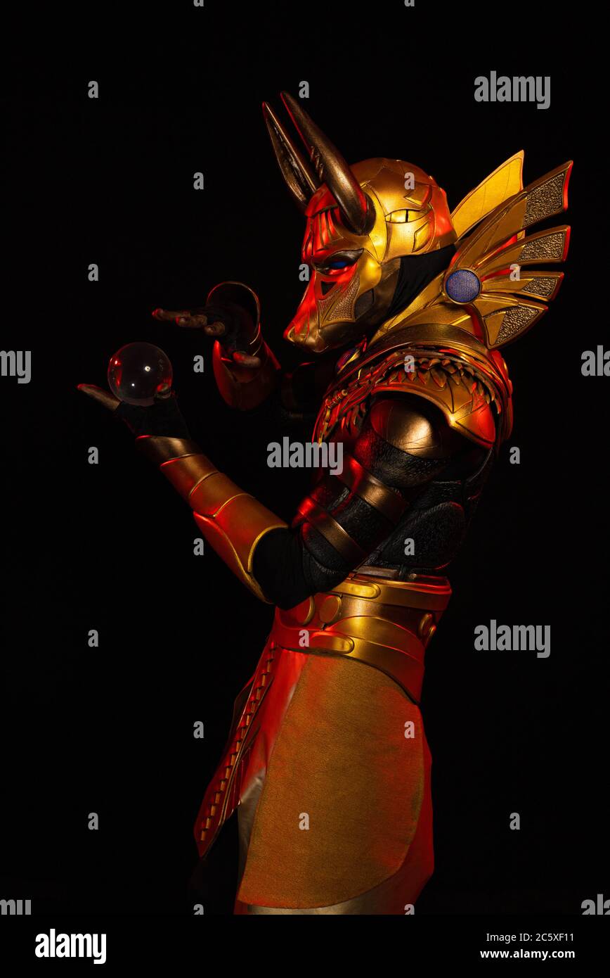 a male actor in a suit of an Egyptian mythology character, the golden ...