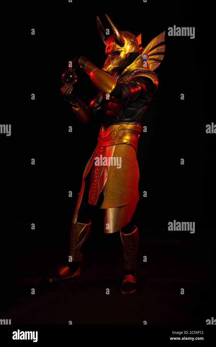 a male actor in a suit of an Egyptian mythology character, the golden ...