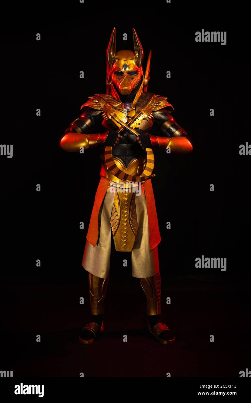 a male actor in a suit of an Egyptian mythology character, the golden ...