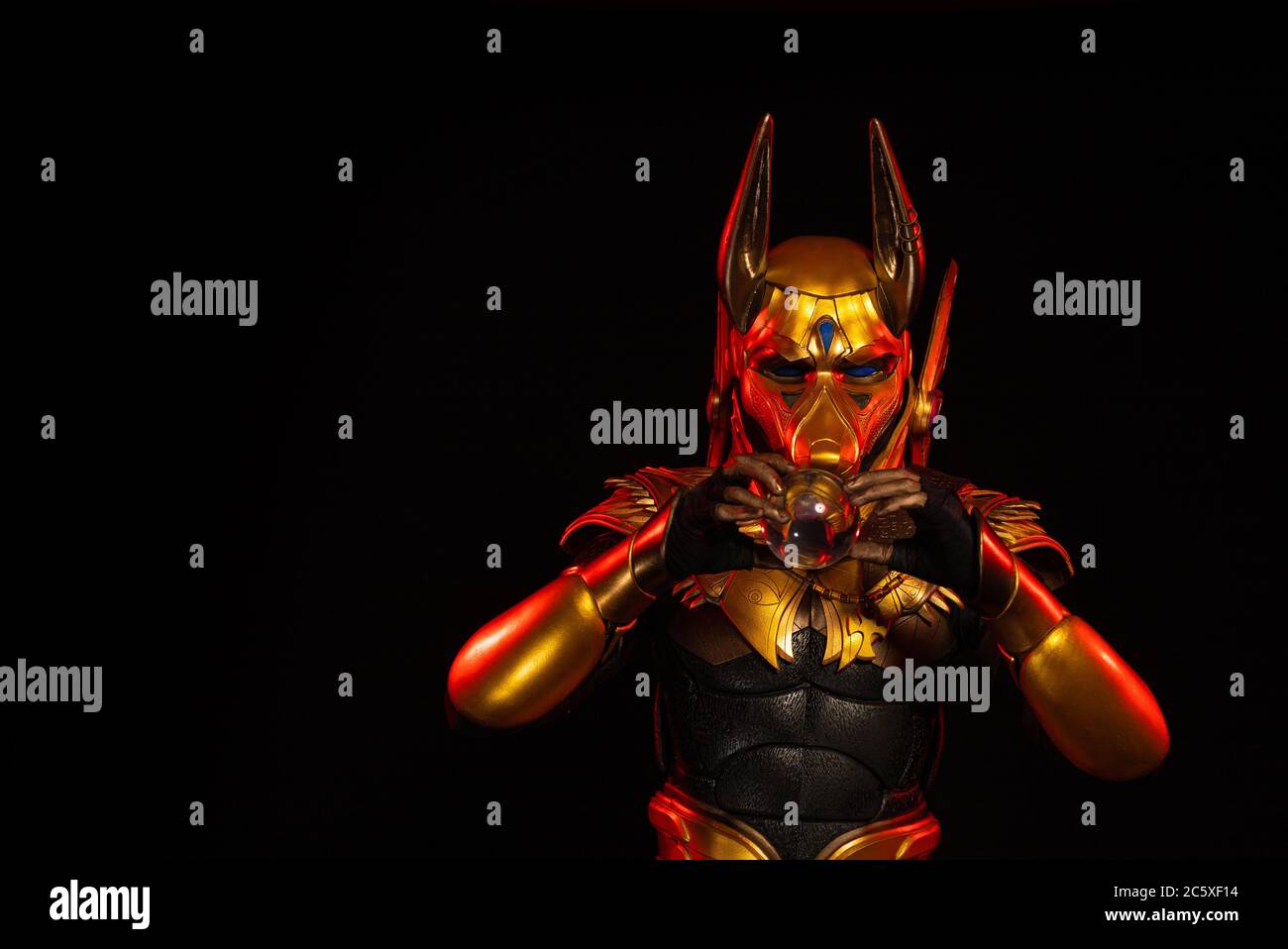 a male actor in a suit of an Egyptian mythology character, the golden ...