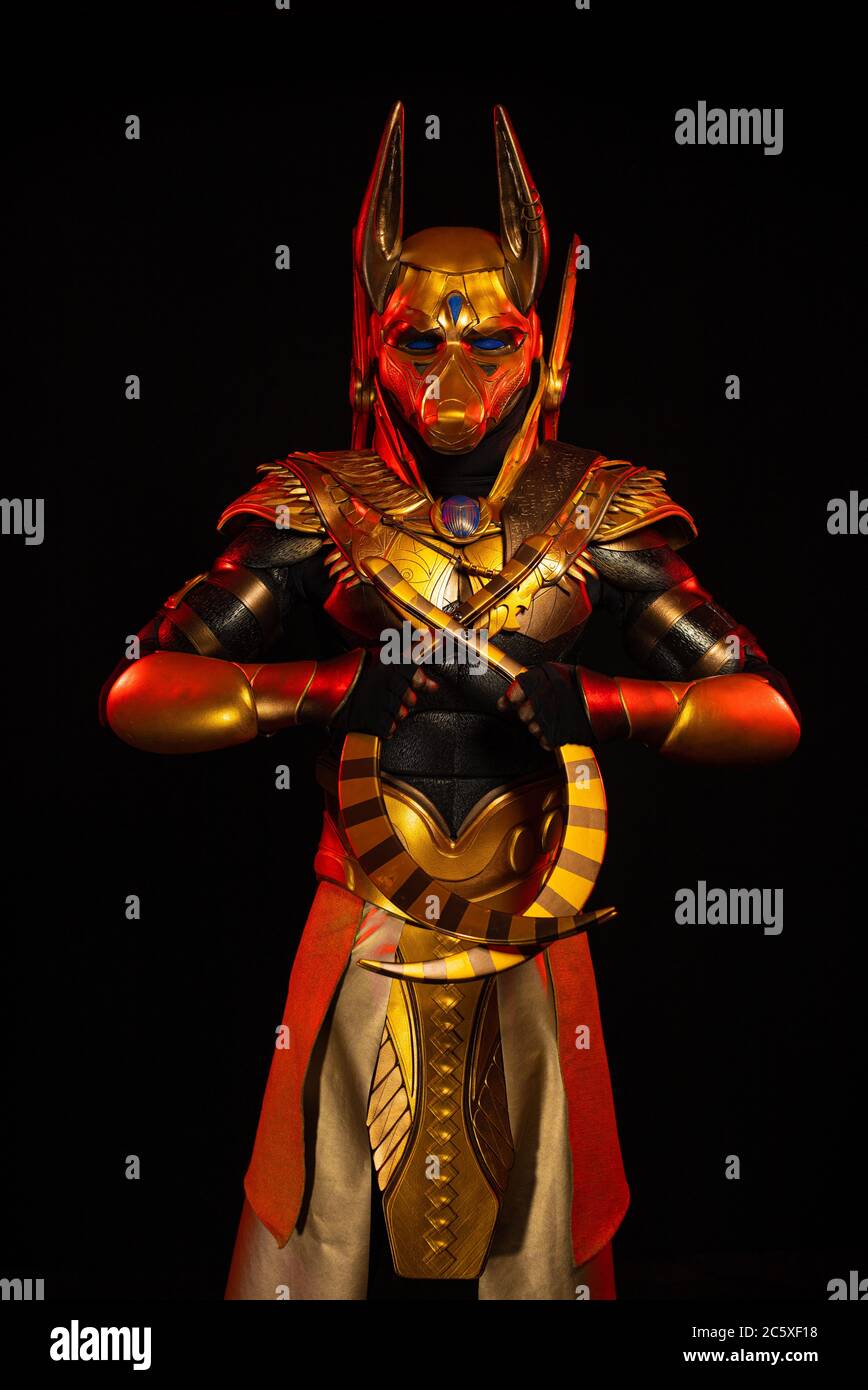 a male actor in a suit of an Egyptian mythology character, the golden ...
