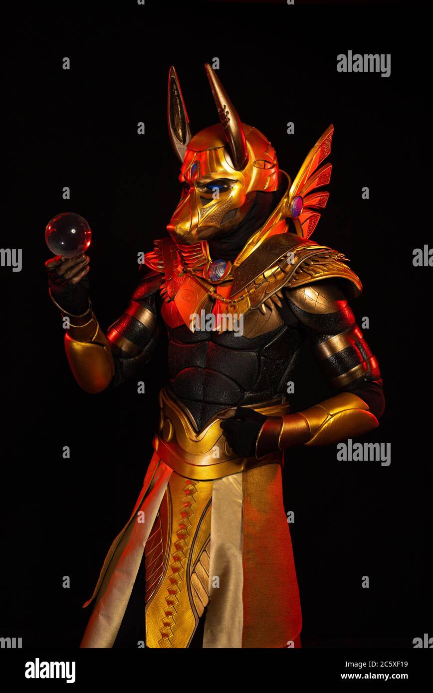 a male actor in a suit of an Egyptian mythology character, the golden ...