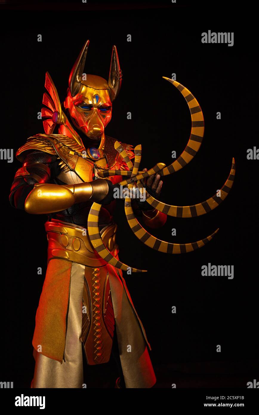 a male actor in a suit of an Egyptian mythology character, the golden ...