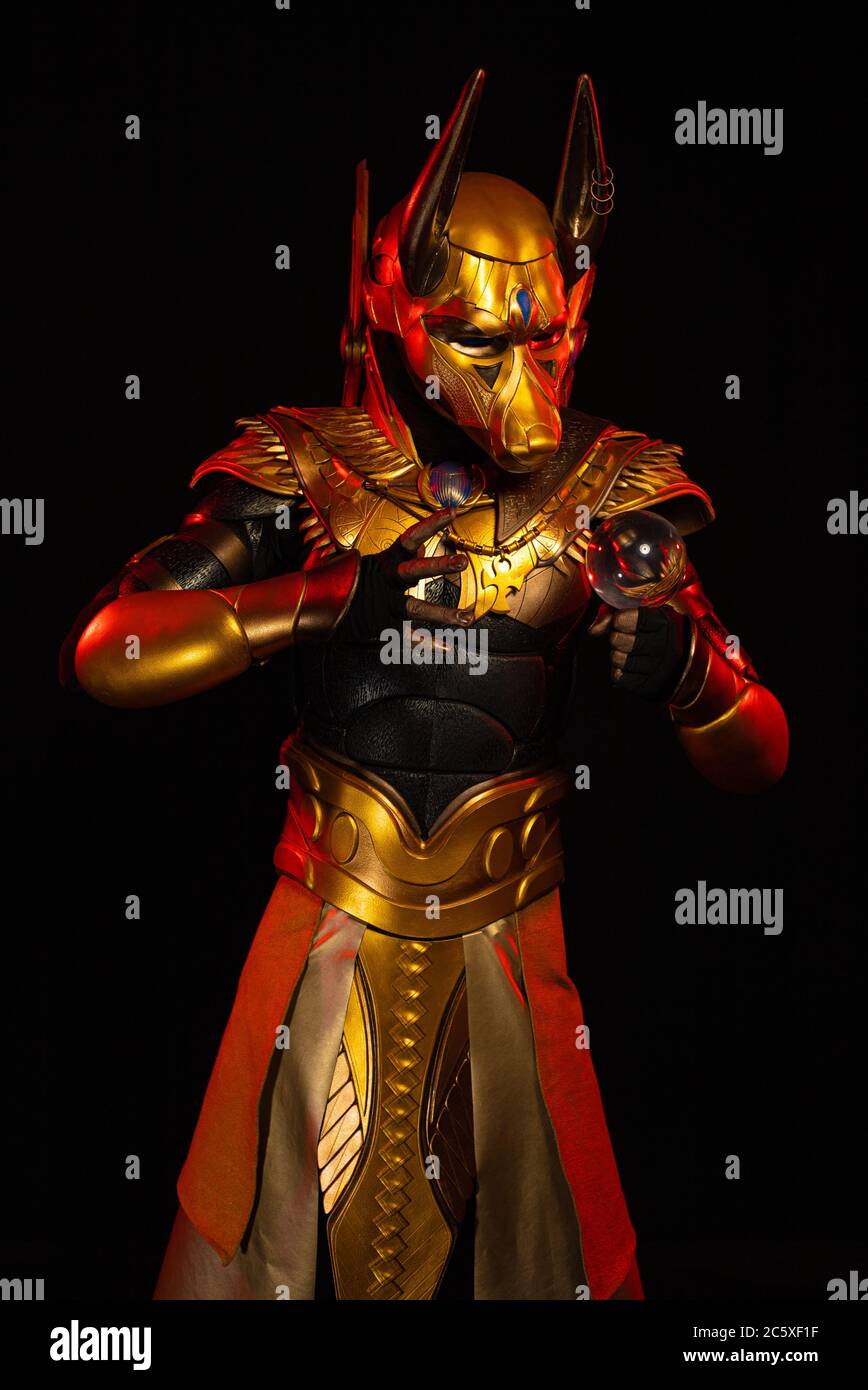 a male actor in a suit of an Egyptian mythology character, the golden ...