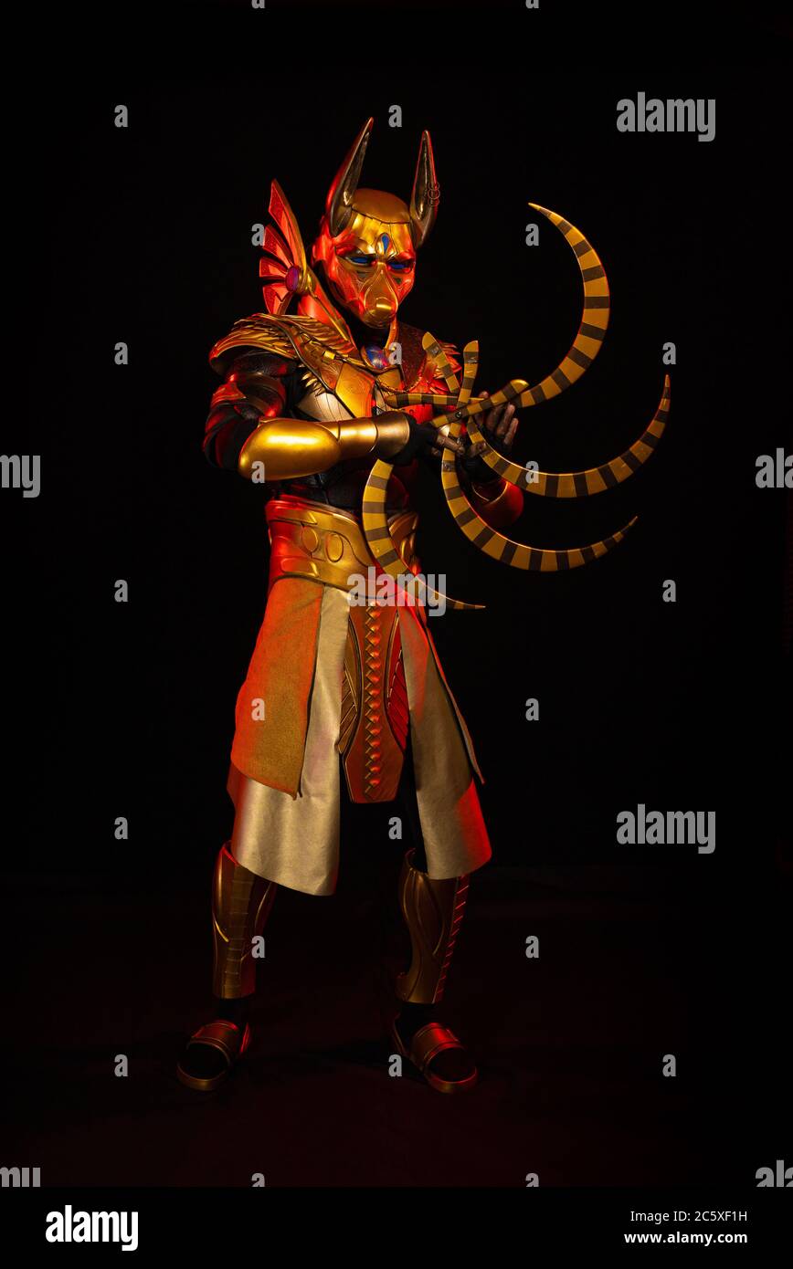 a male actor in a suit of an Egyptian mythology character, the golden ...