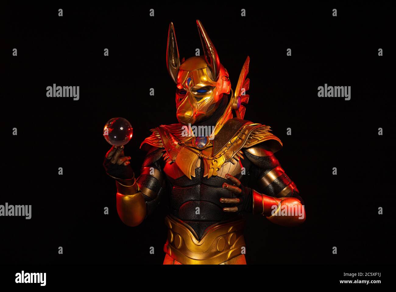 a male actor in a suit of an Egyptian mythology character, the golden ...