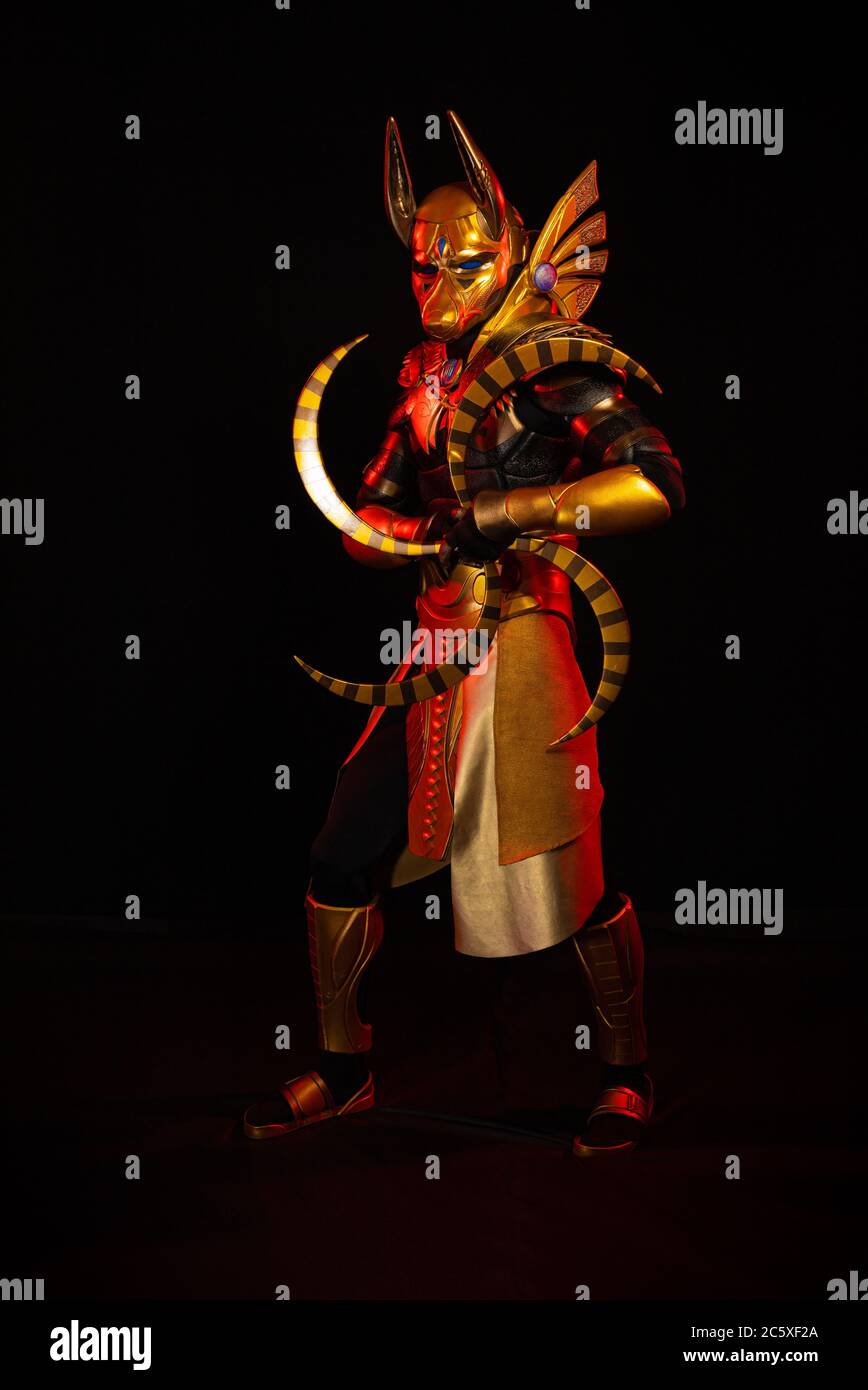 a male actor in a suit of an Egyptian mythology character, the golden ...