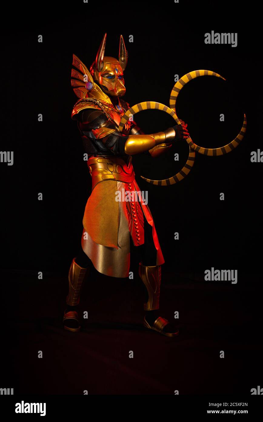 a male actor in a suit of an Egyptian mythology character, the golden ...
