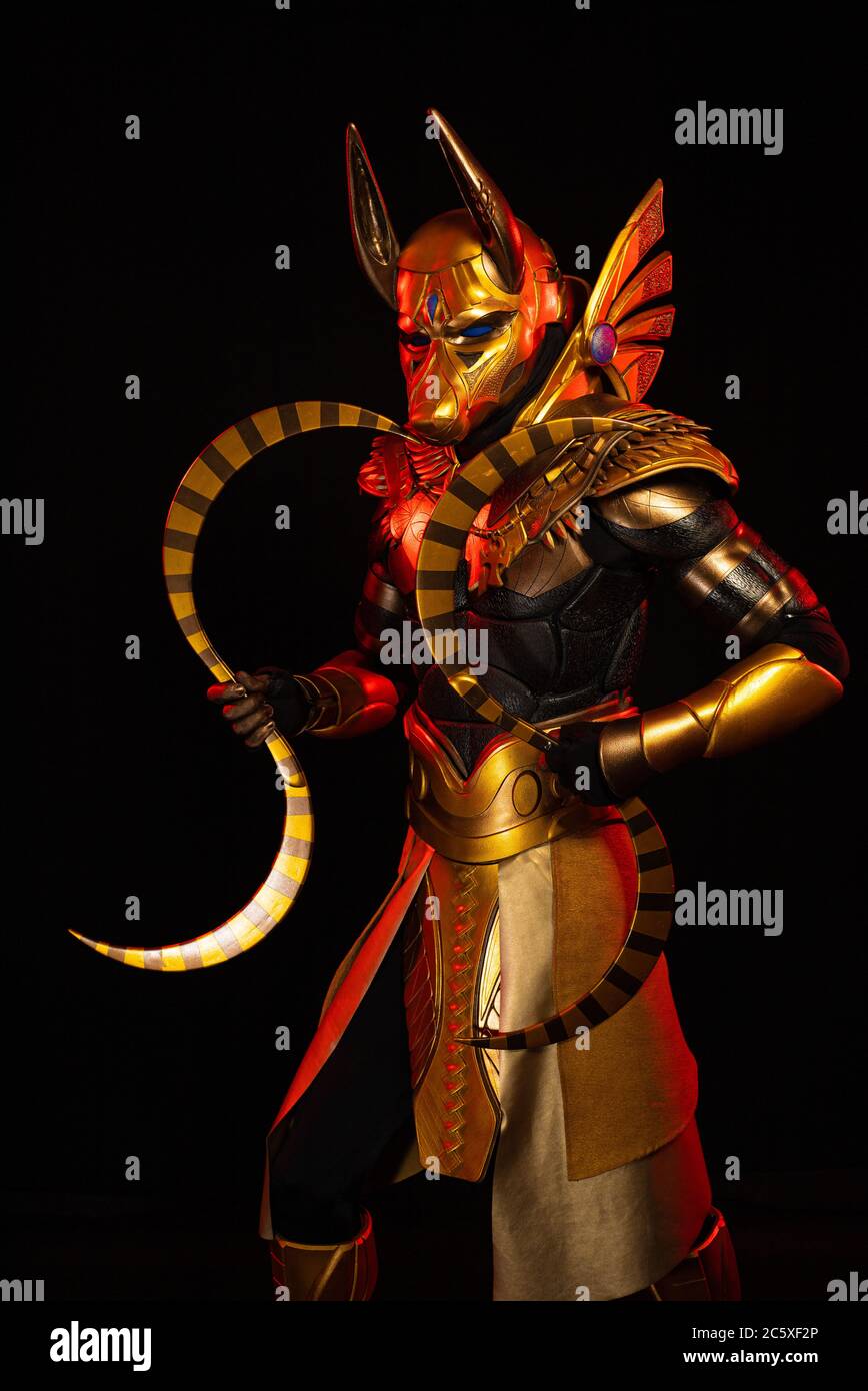 a male actor in a suit of an Egyptian mythology character, the golden ...