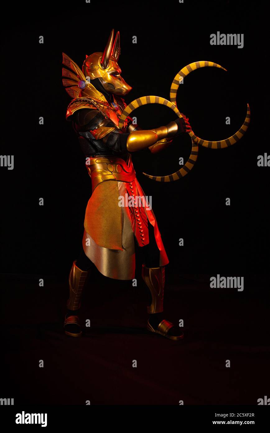 a male actor in a suit of an Egyptian mythology character, the golden ...