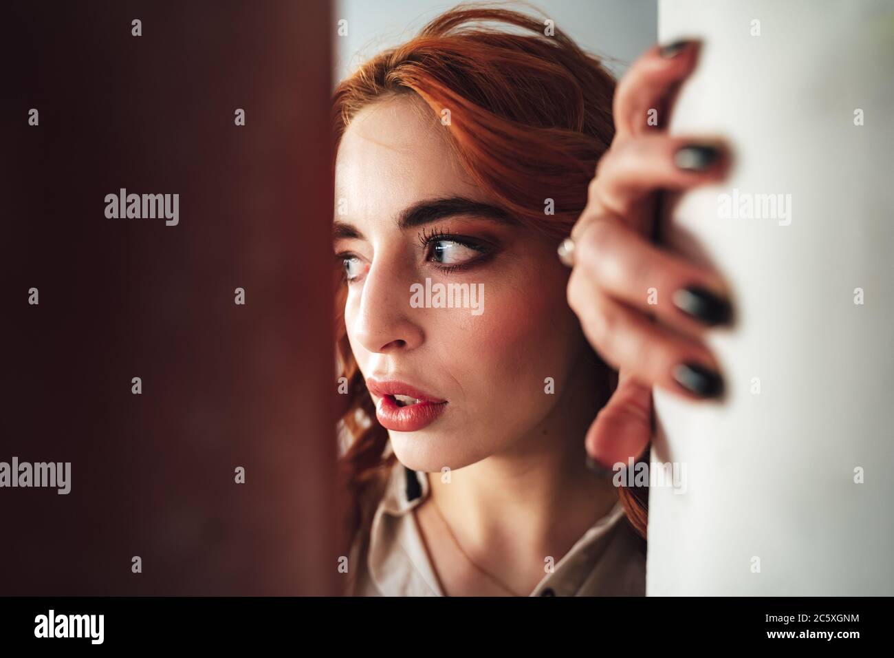 Side view of attractive young woman. Female model looking to side ...