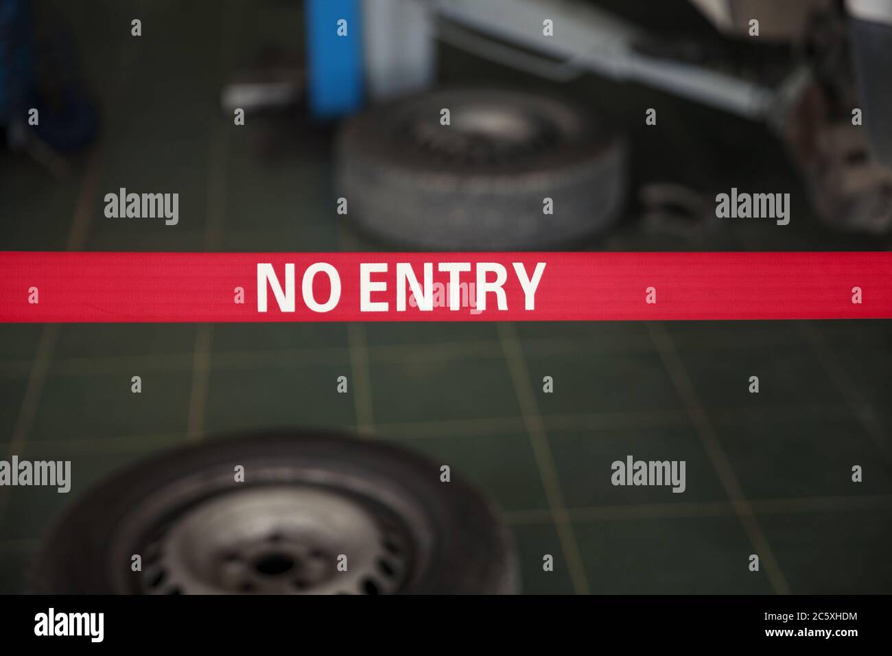 no entry, the inscription on the red bar in the car service, close up ...