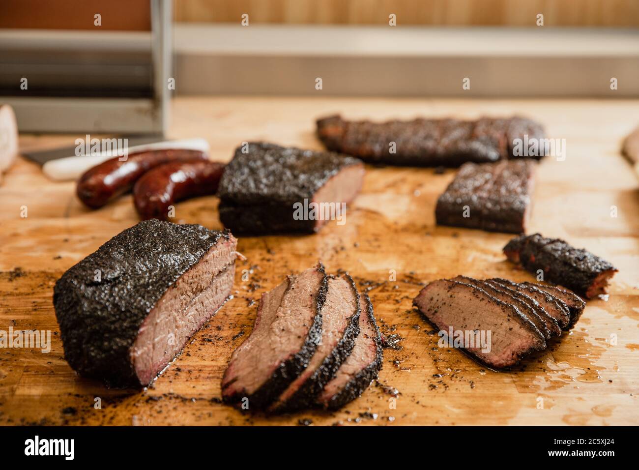 Cutting Smoked Meats at a Barbecue Restaurant Stock Photo - Alamy
