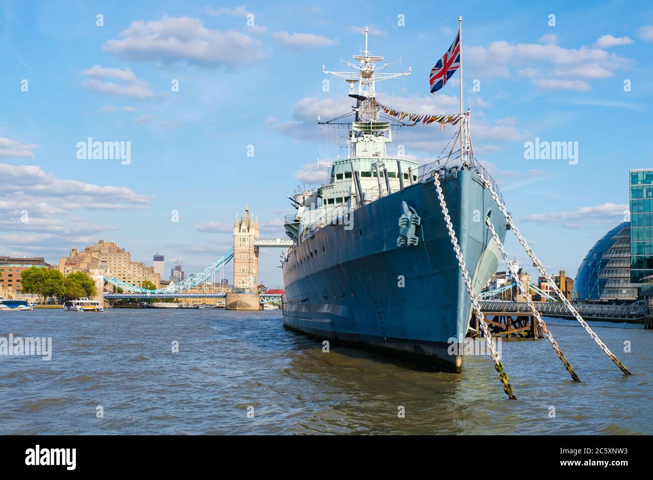 The HMS Belfast warship docked near Tower Bridge on the river Thames in ...