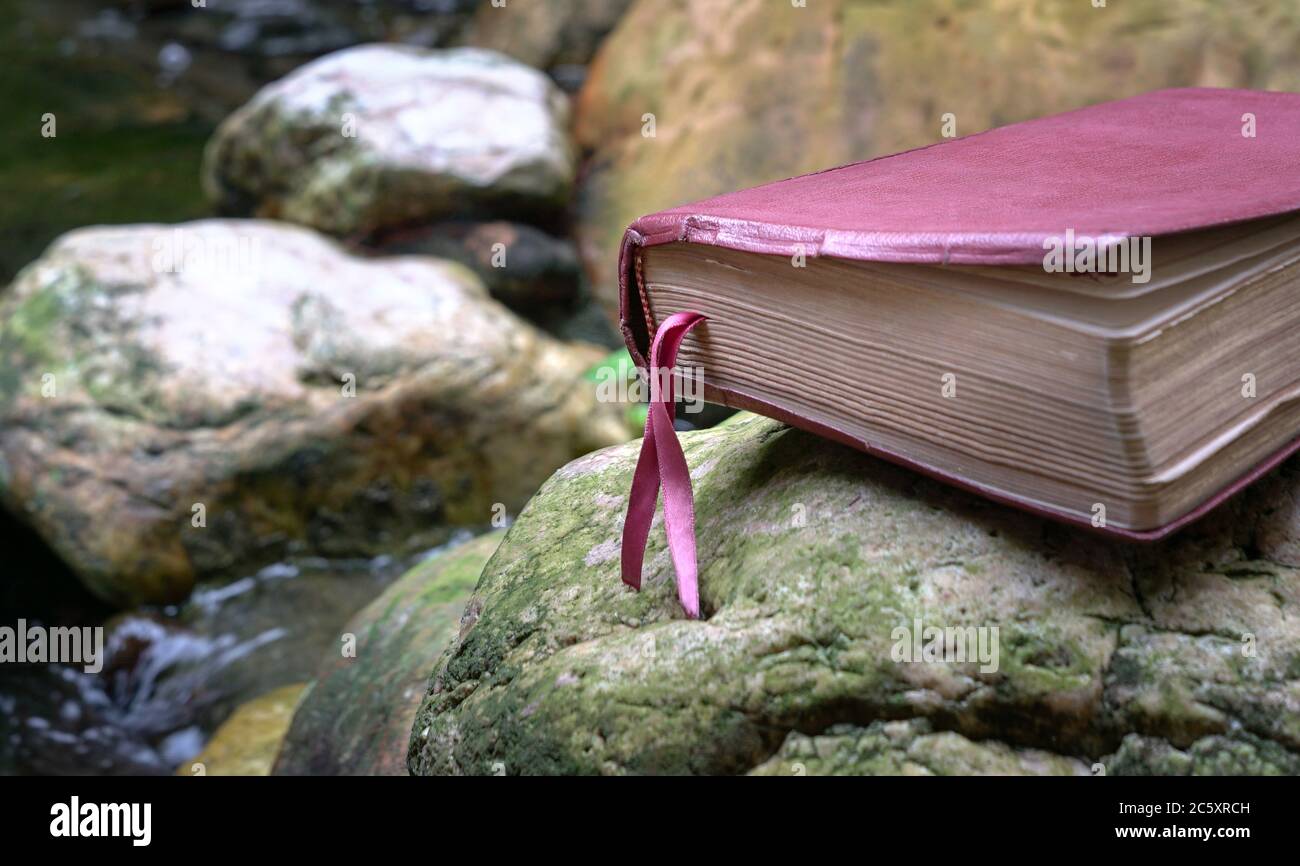 Open bible on top of a rock hi-res stock photography and images - Alamy