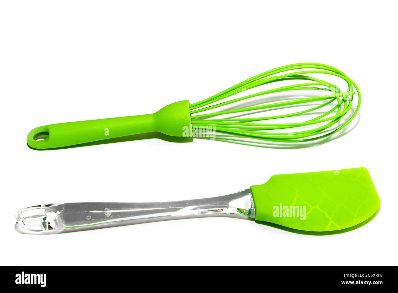 Set of green silicone culinary spatula and whisk Isolated on white ...