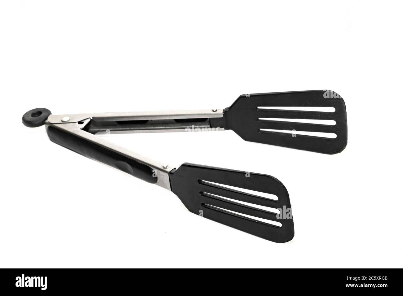 Close up culinary tongs isolated on a white background Stock Photo - Alamy