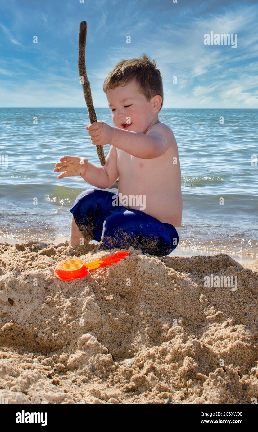 Boy digs water hi-res stock photography and images - Alamy