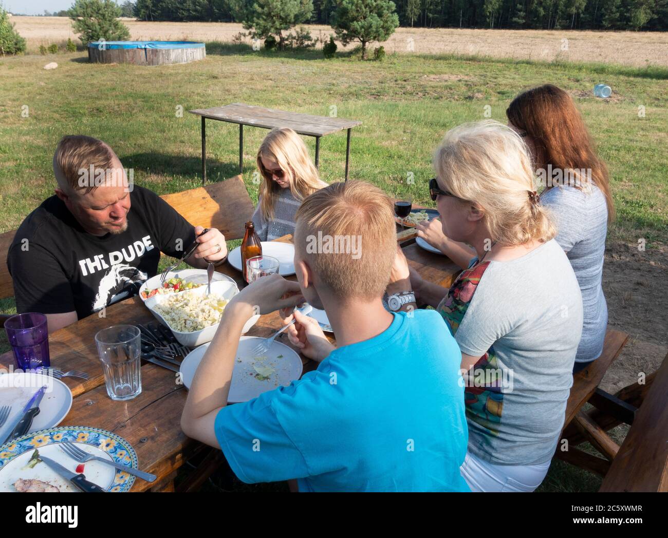 Polish family and guests enjoying a picnic in their yard. Zawady Gmina ...