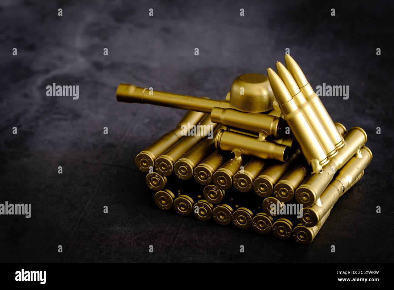 bullet shell toy tank on a black background Stock Photo - Alamy