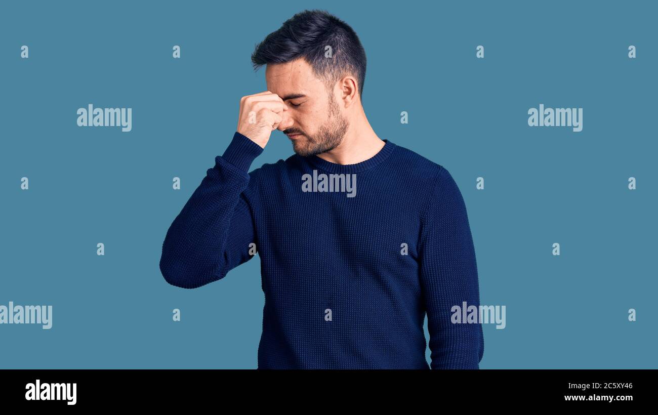 Young handsome man wearing casual clothes tired rubbing nose and eyes ...