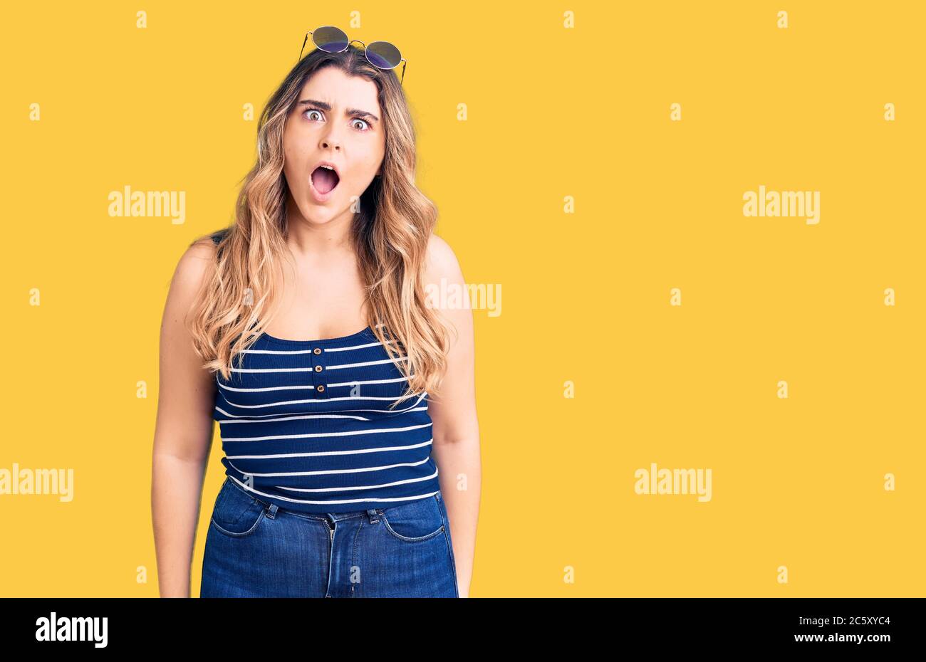 Young Caucasian Woman Wearing Casual Clothes And Sunglasses Scared And