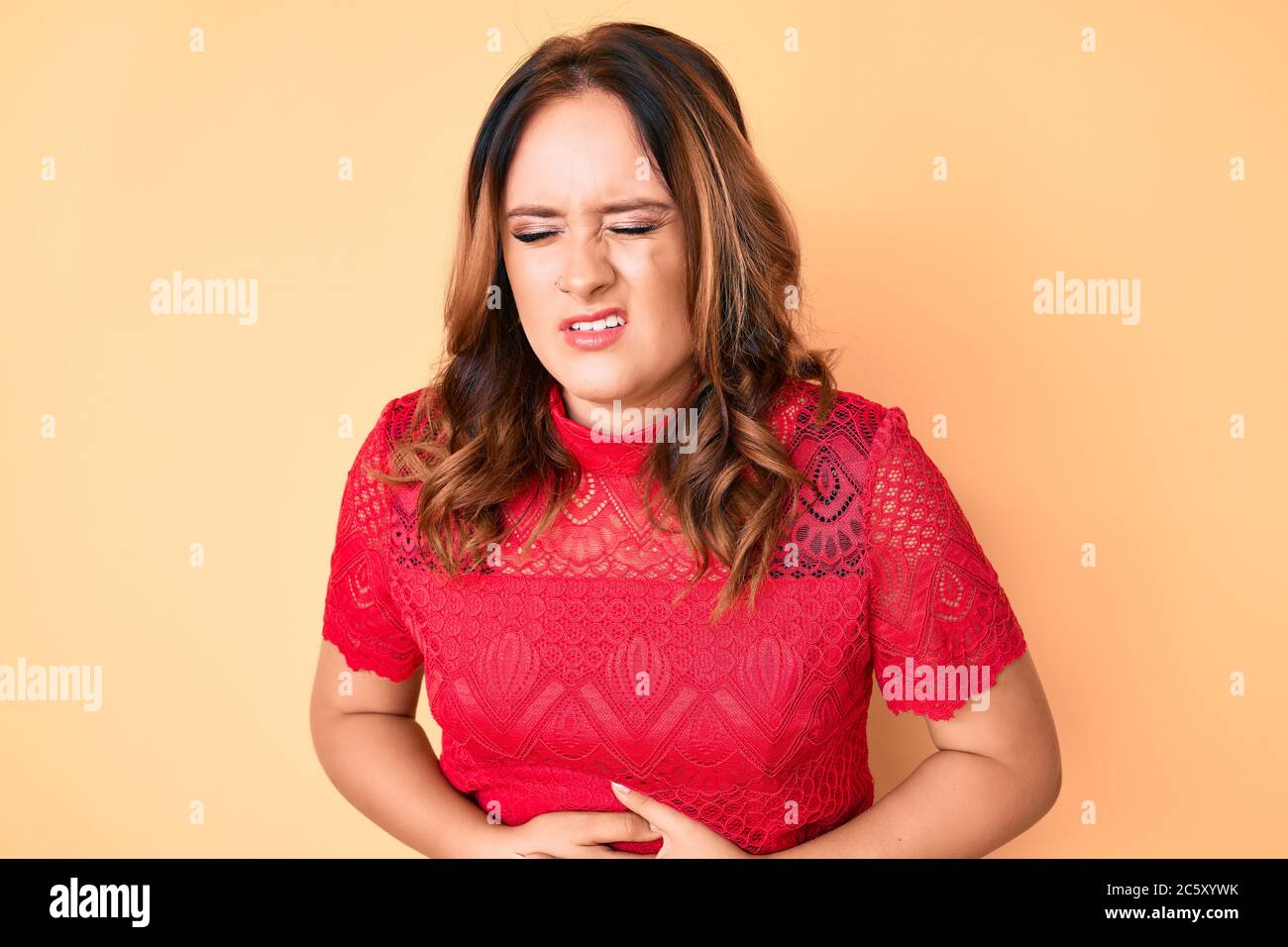 Young beautiful caucasian woman wearing casual clothes with hand on ...