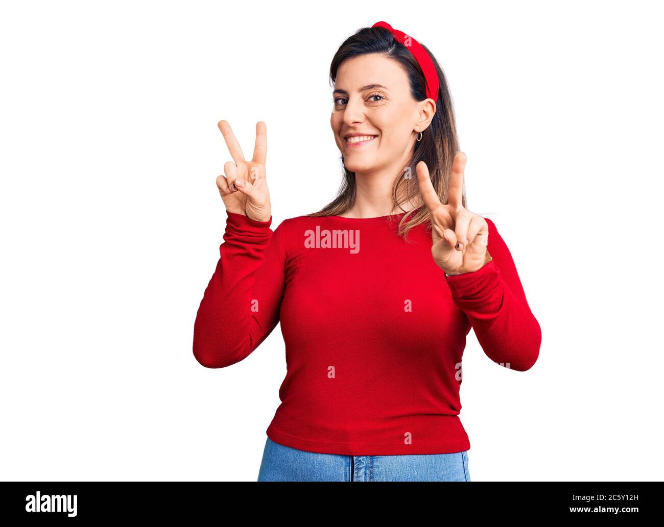 Young beautiful woman wearing casual clothes smiling looking to the ...