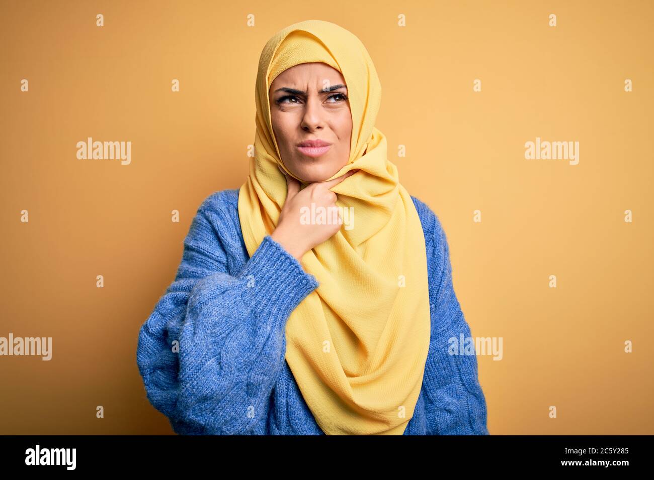 Young beautiful brunette muslim woman wearing arab hijab over isolated ...